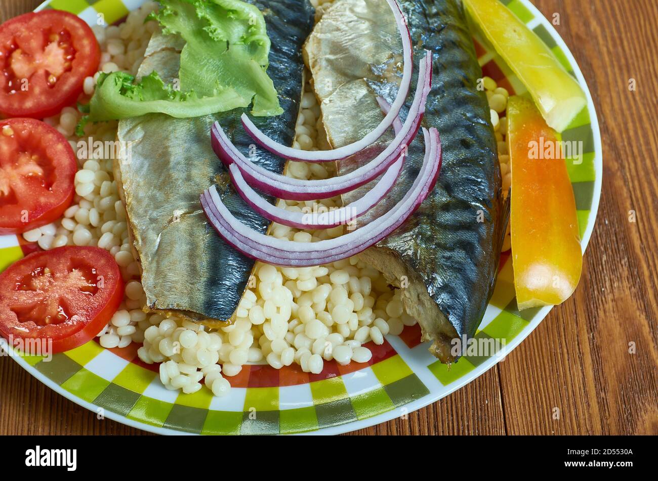 Israeli Fried mackerel fish with Ptitim close up Mediterranean cuisine ...