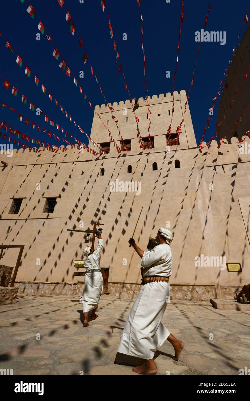 Traditional Omani sword dance in Nizwa fort, Oman Stock Photo - Alamy