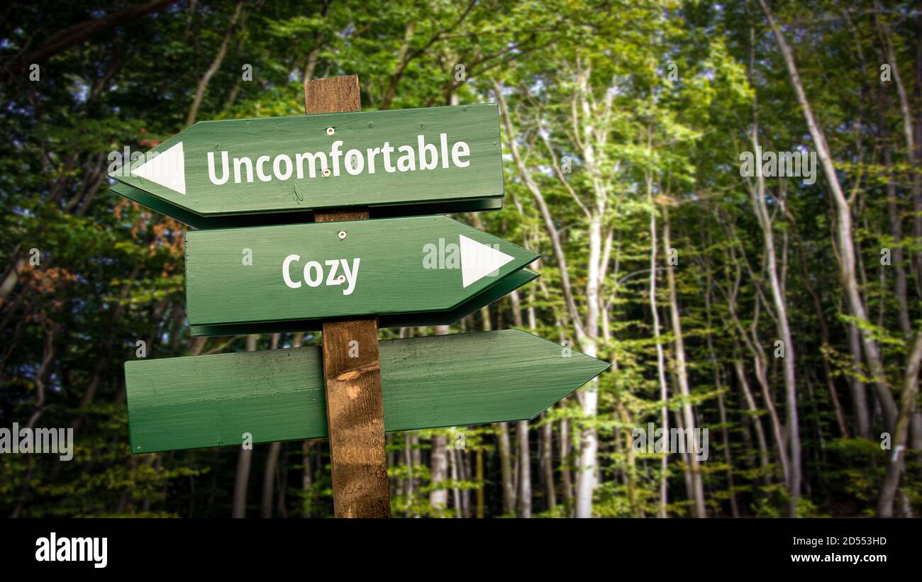 Street Sign the Direction Way to Cozy versus Uncomfortable Stock Photo ...