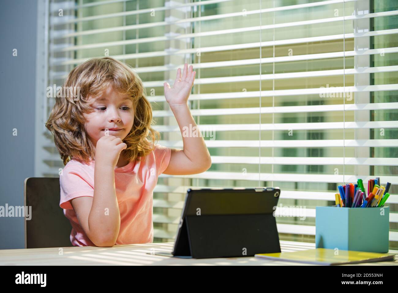 Cute kid use tablet, have web lesson on quarantine, homeschooling ...