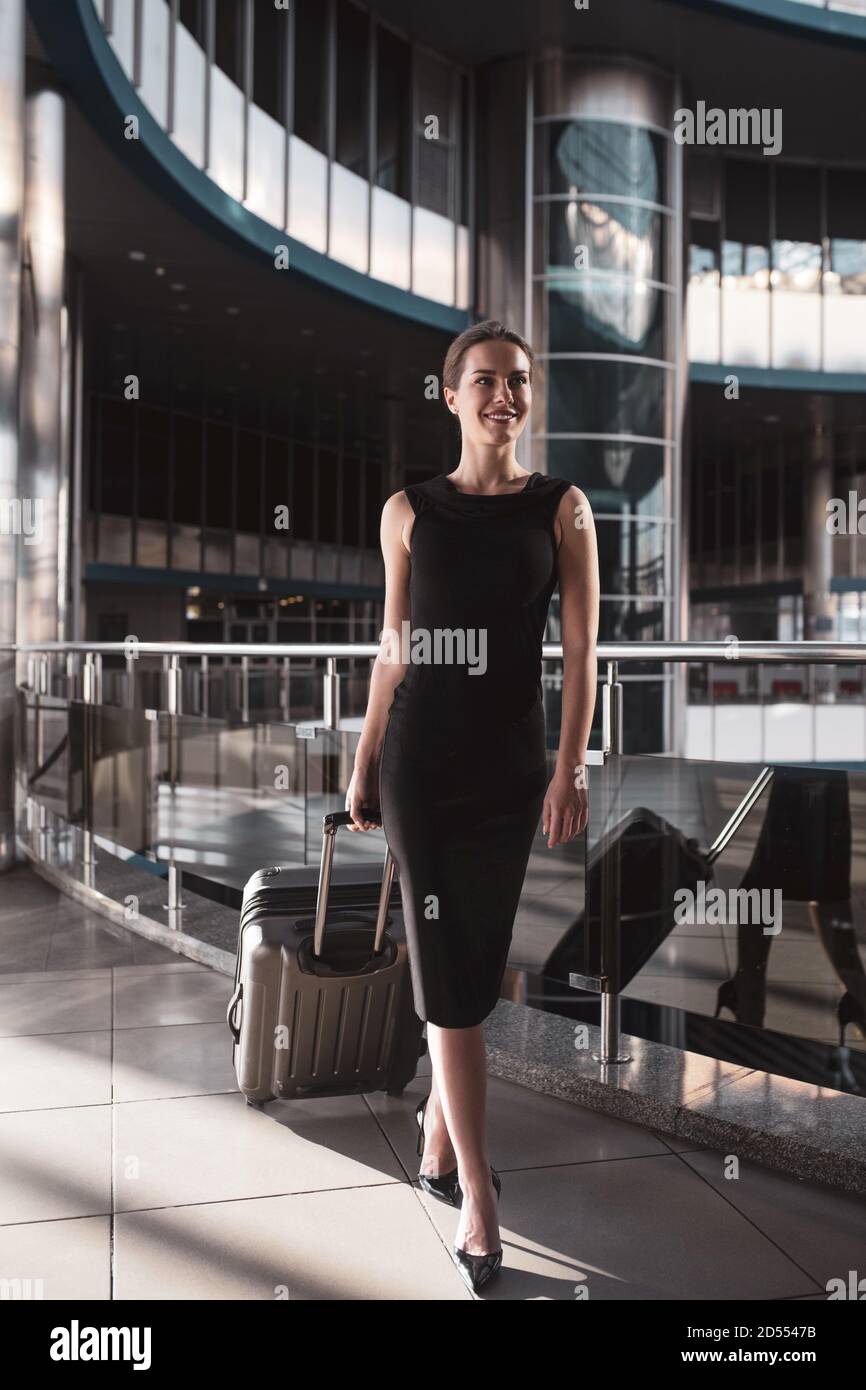 Business lady getting ready for her flight Stock Photo - Alamy