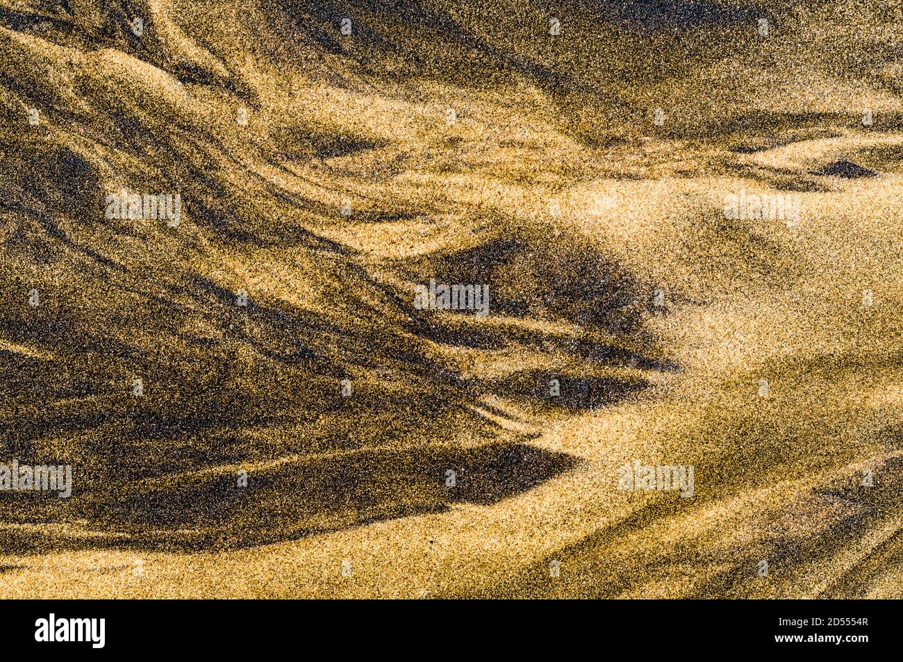 Closeup detail of beach sand shapes and forms induced by water Stock ...