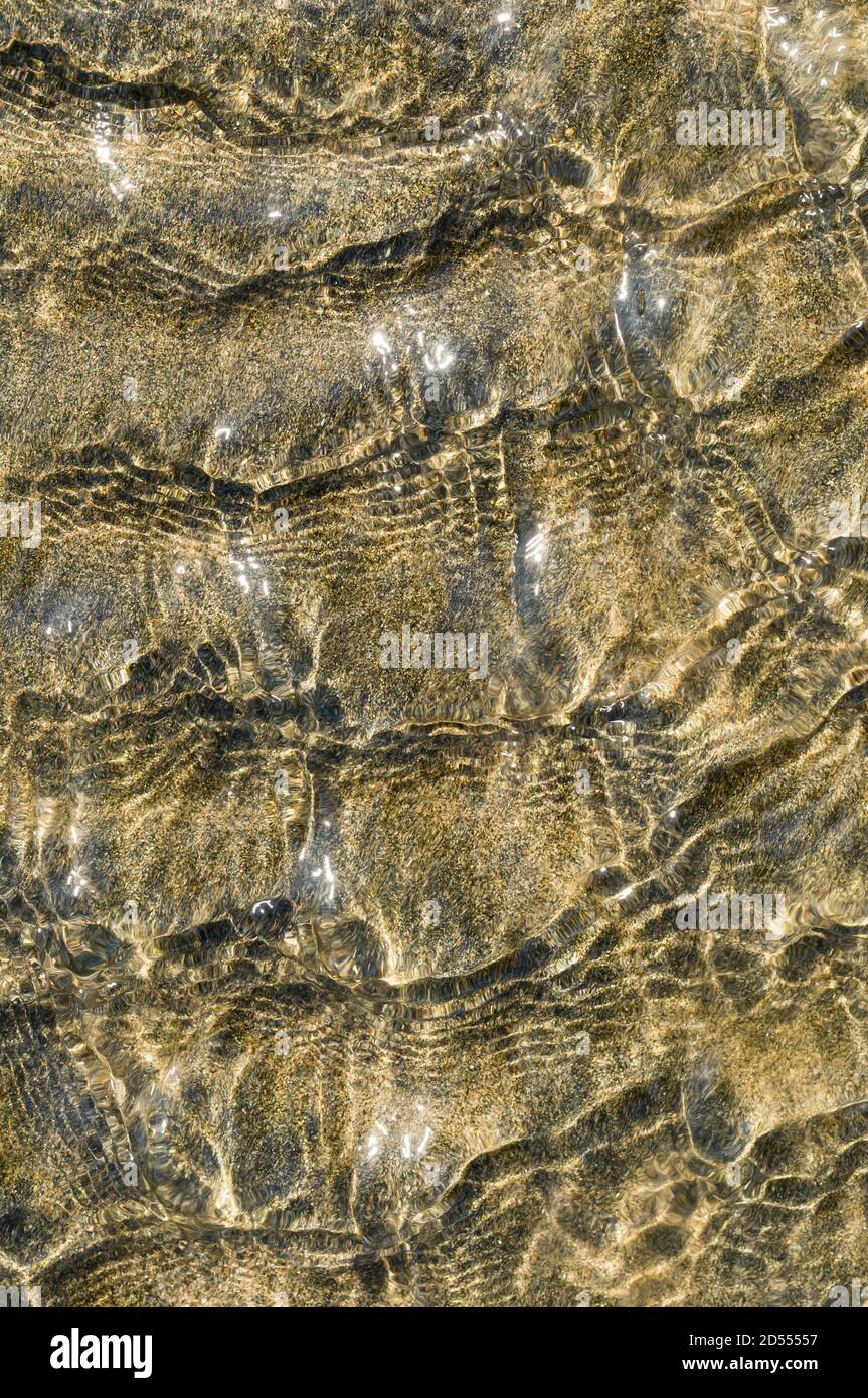 Closeup detail of beach sand shapes and forms induced by water Stock ...