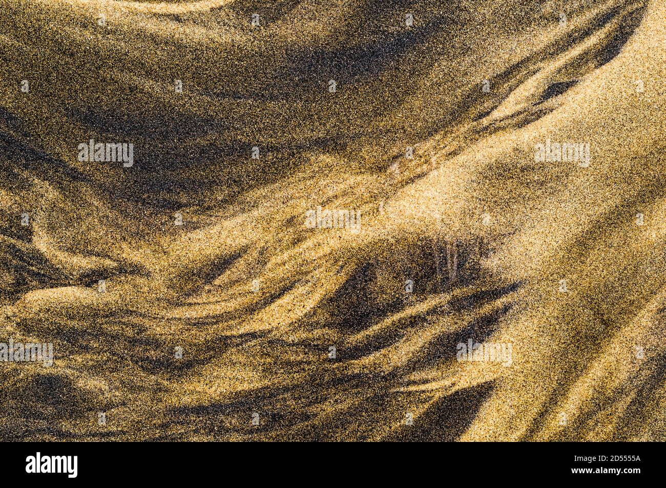 Closeup detail of beach sand shapes and forms induced by water Stock ...