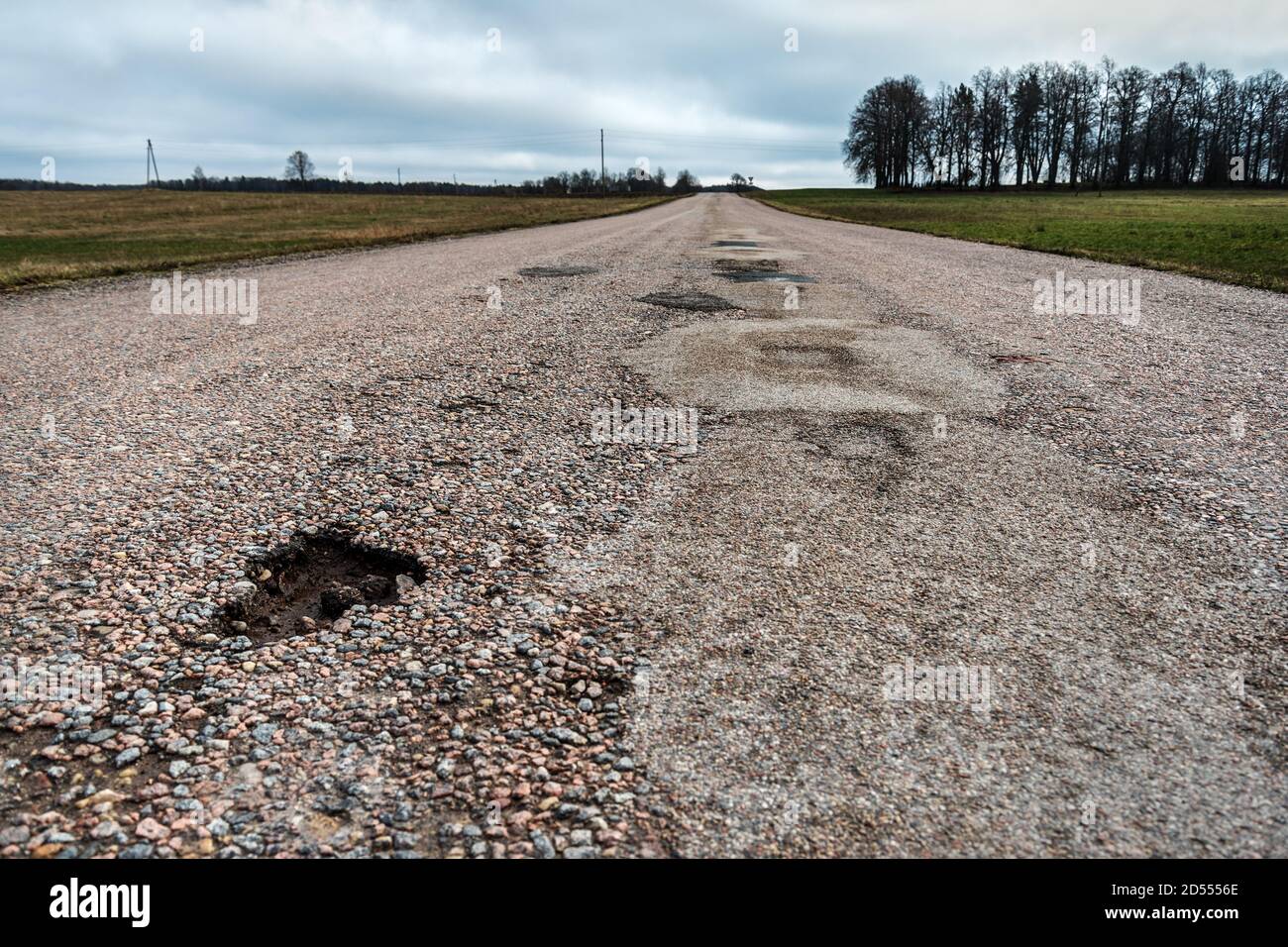 Weathered hole on asphalt of road Stock Photo - Alamy