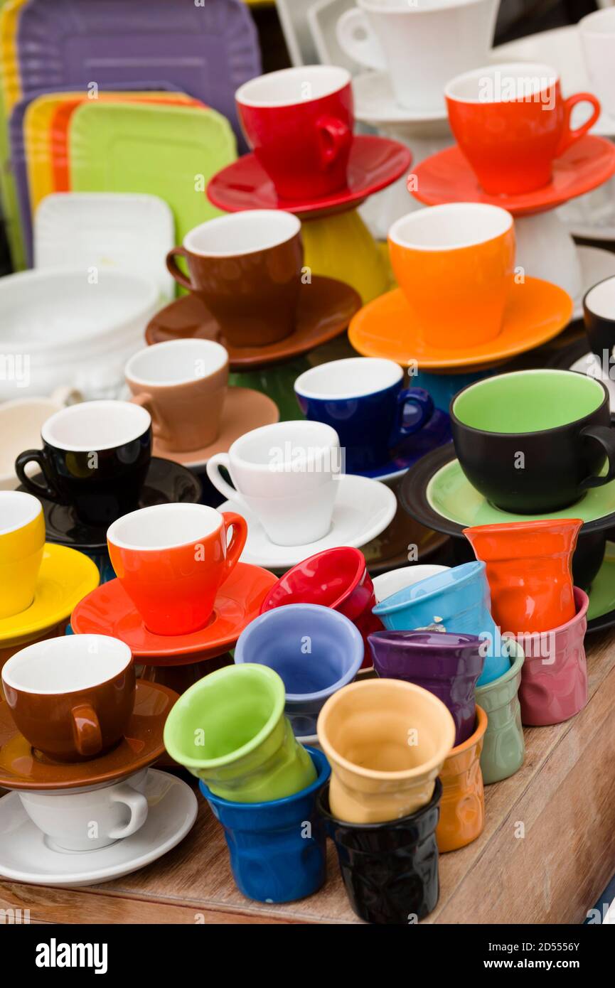 Porcelain cups of different sizes and colors Stock Photo - Alamy