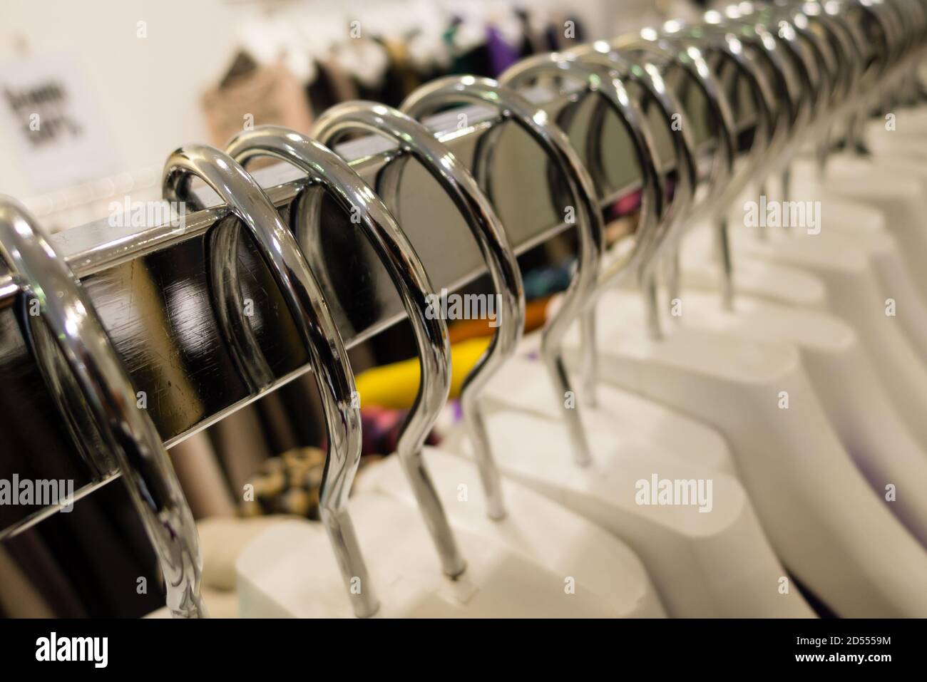 Row of clothes hangers Stock Photo - Alamy