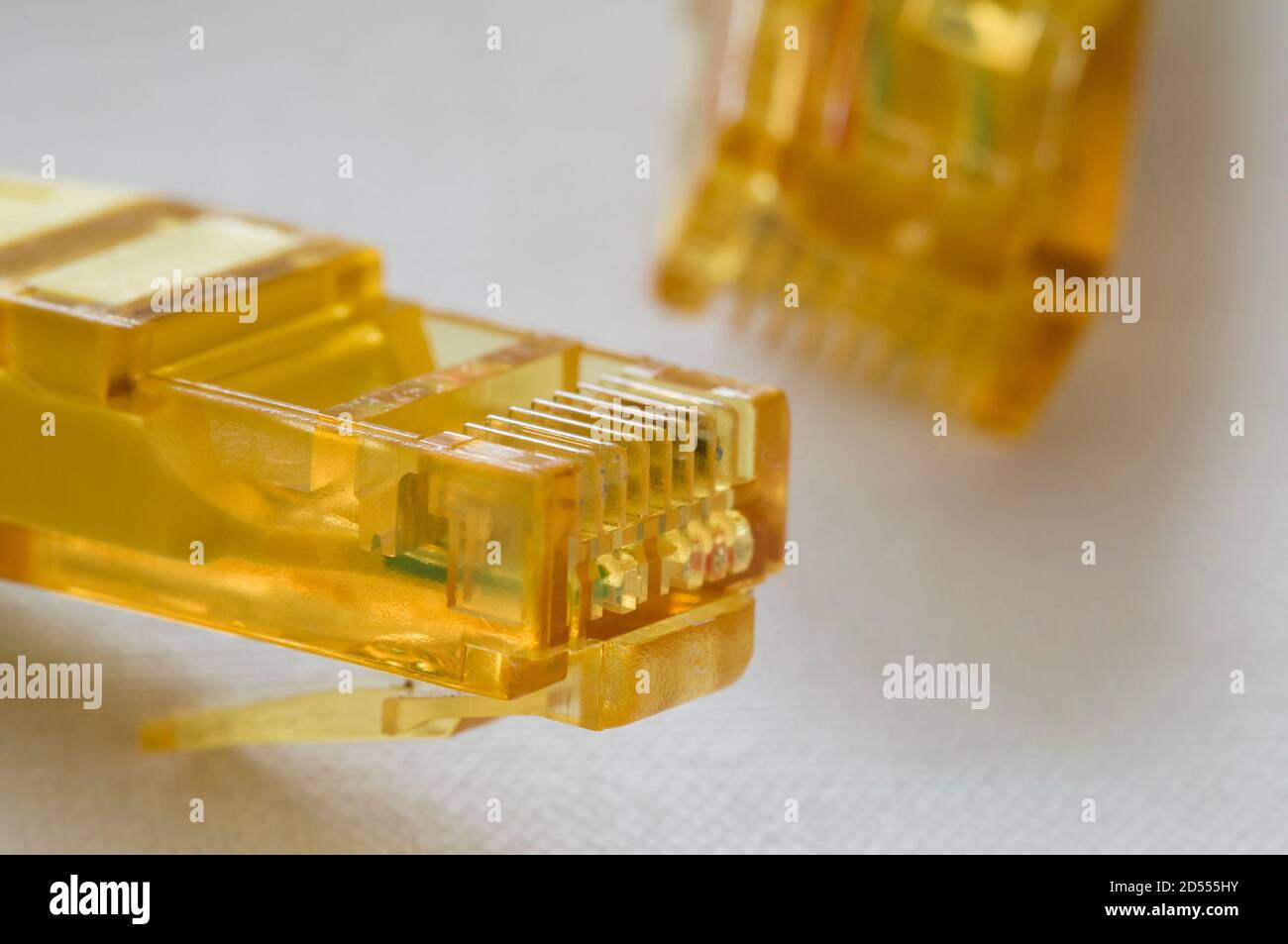Yellow LAN cable plugs for internet communication Stock Photo - Alamy