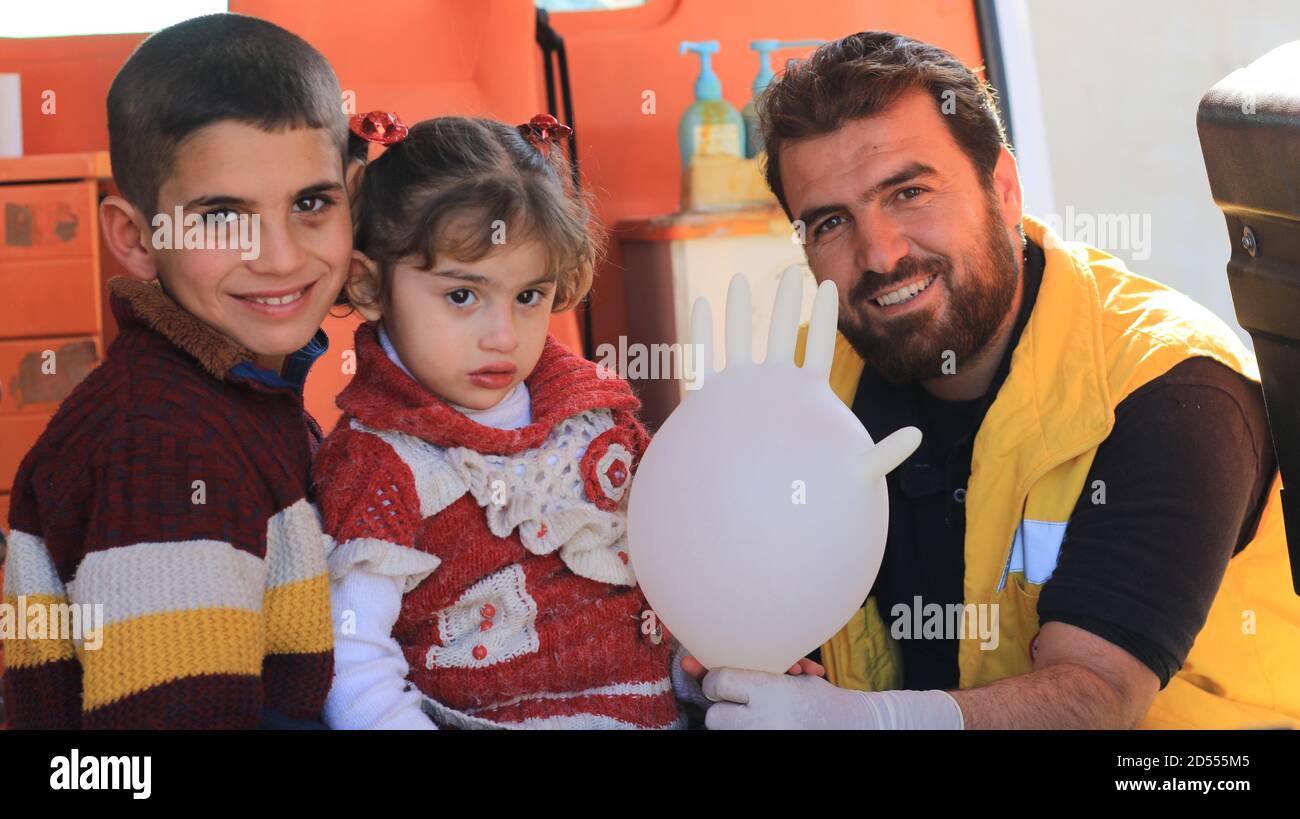 nurse tries to make a sick child laugh Stock Photo - Alamy