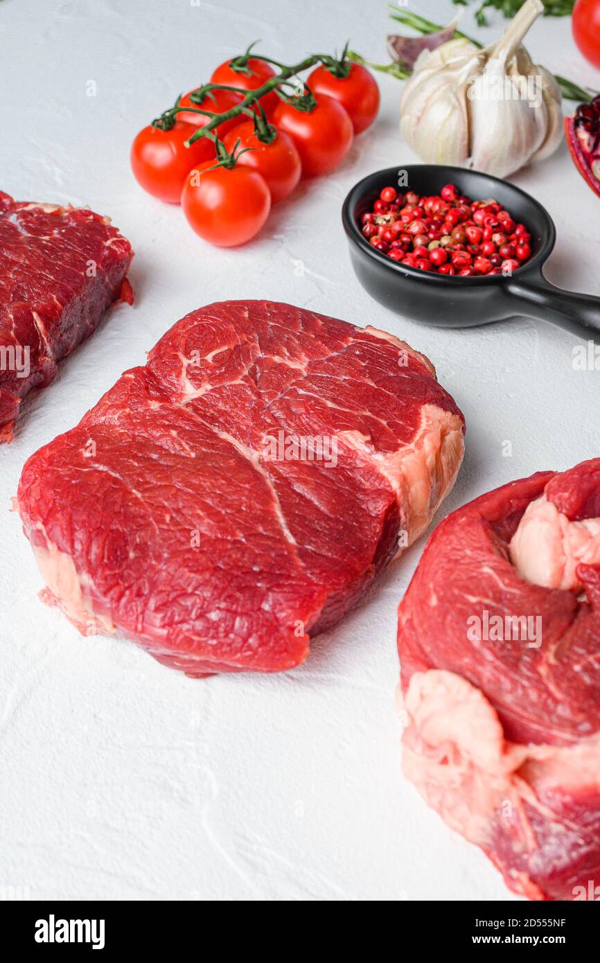 Beef cuts Chuck eye roll, top blade, rump steak with red wine in glass ...