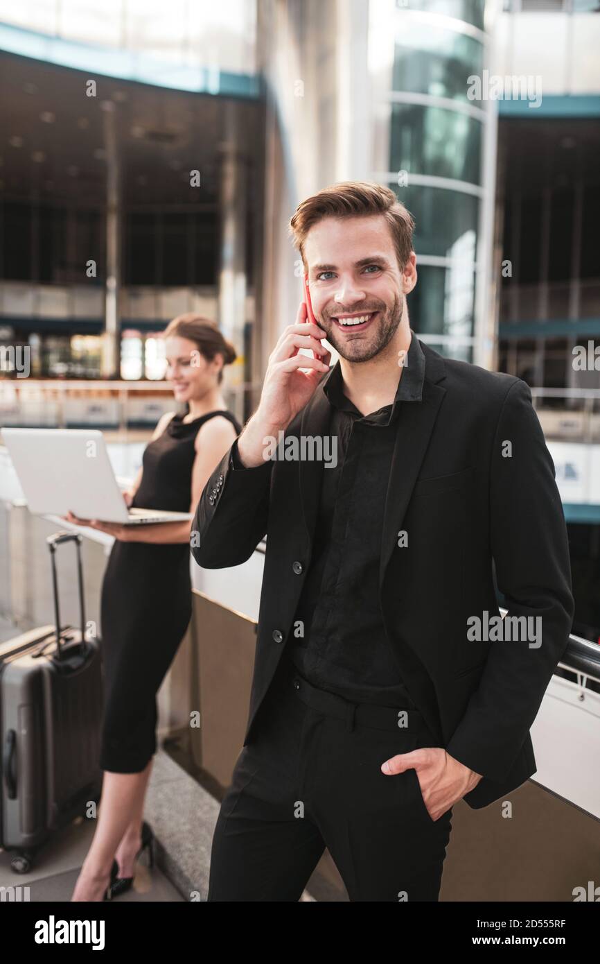 Confident handsome man making a phone call Stock Photo - Alamy