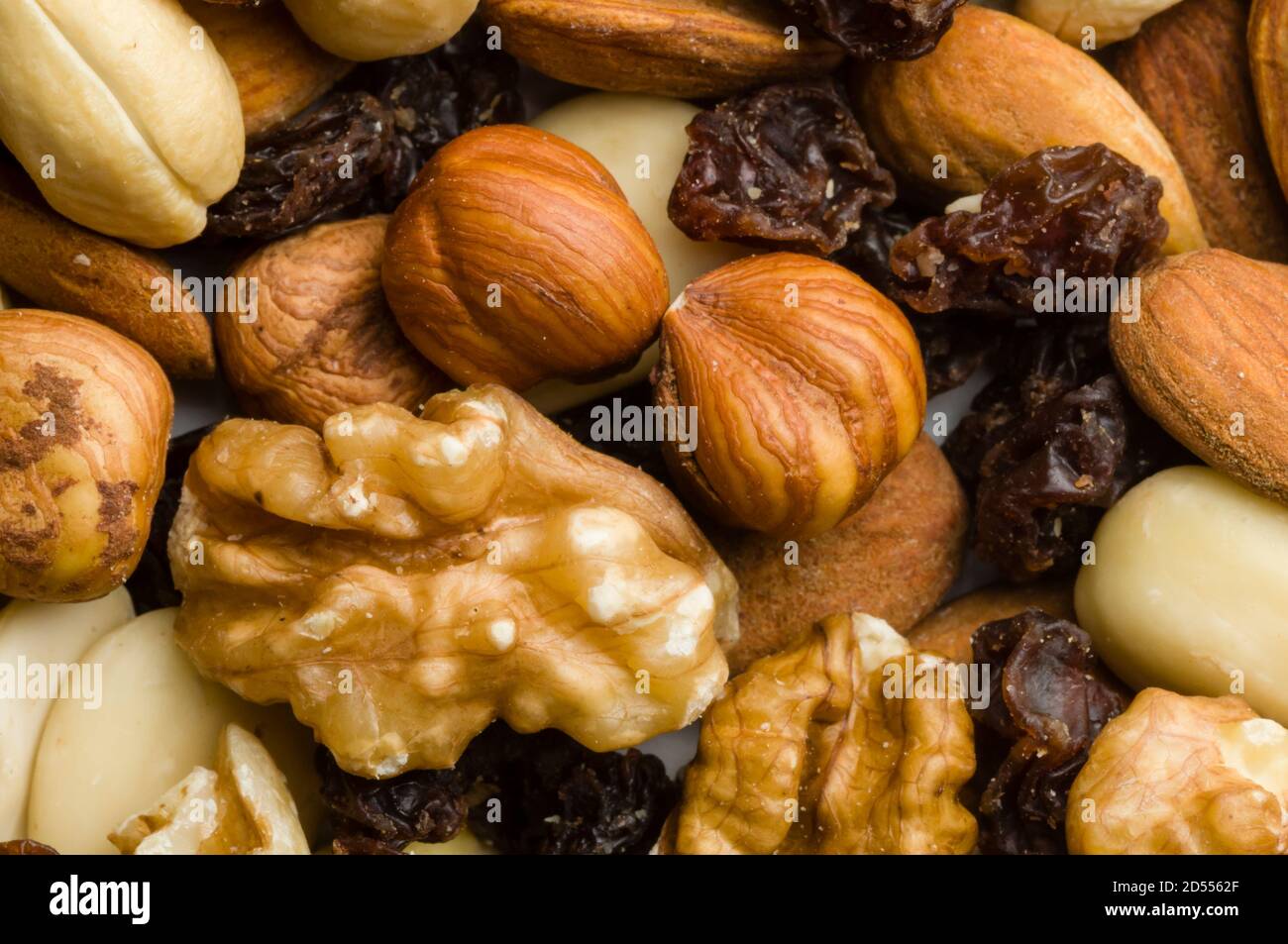 Healthy nuts, almonds and raisins Stock Photo - Alamy