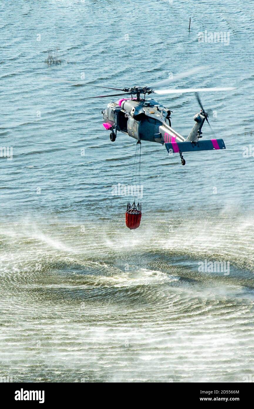 Scoops water from sea hi-res stock photography and images - Alamy