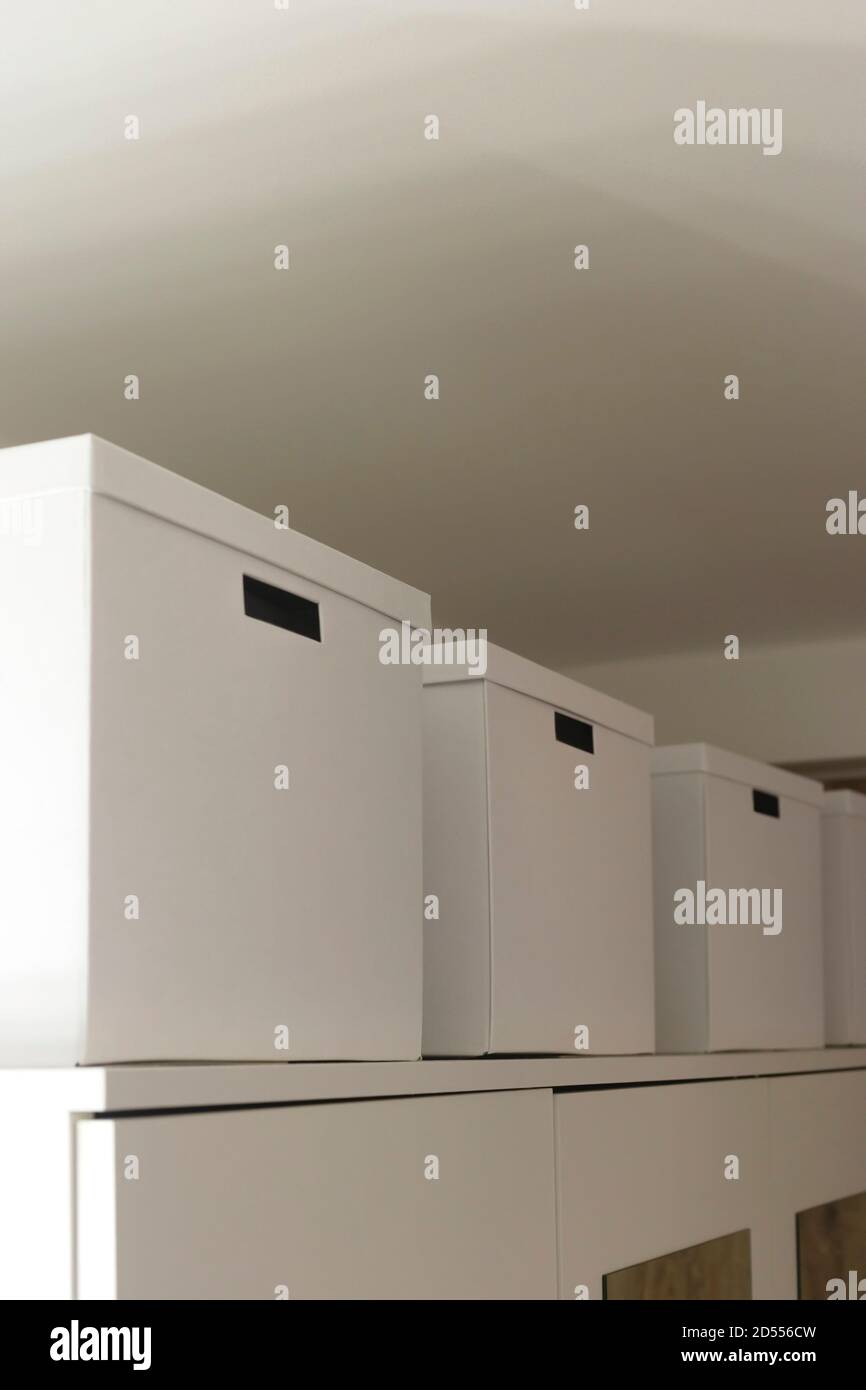 White cardboard boxes as a storage element in the interior Stock Photo ...