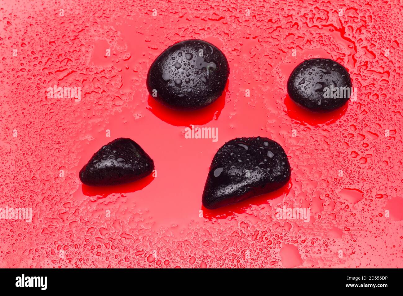 Color stones on a green background; various colors, yellow, black ...