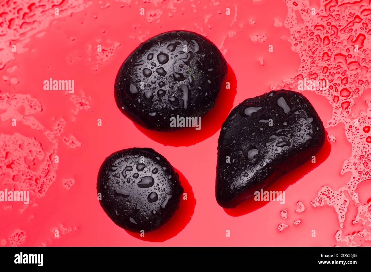 Color stones on a green background; various colors, yellow, black ...