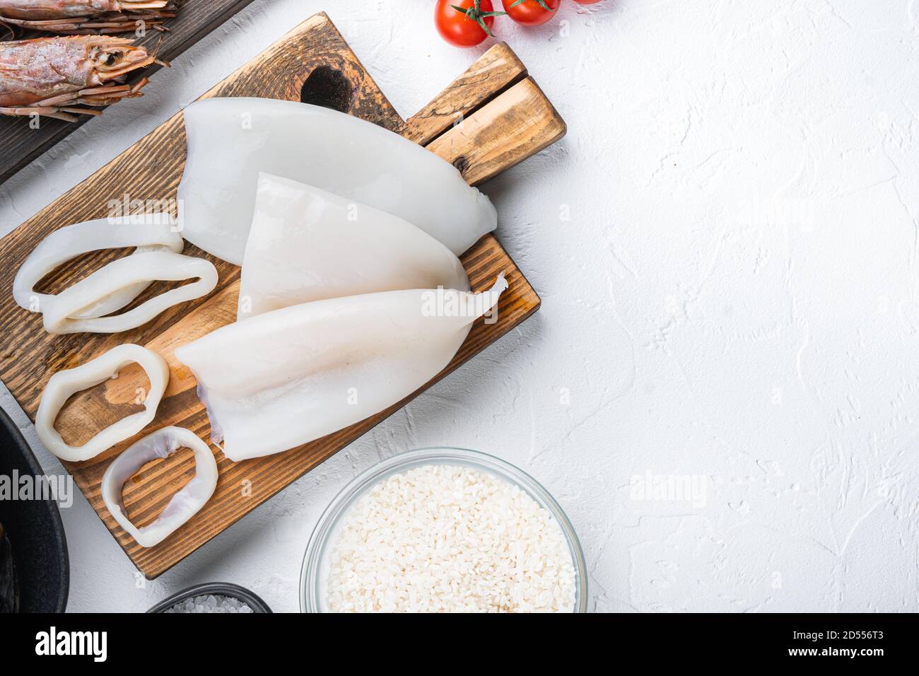 Fresh raw cuttlefish or squid on white background, top view with space ...