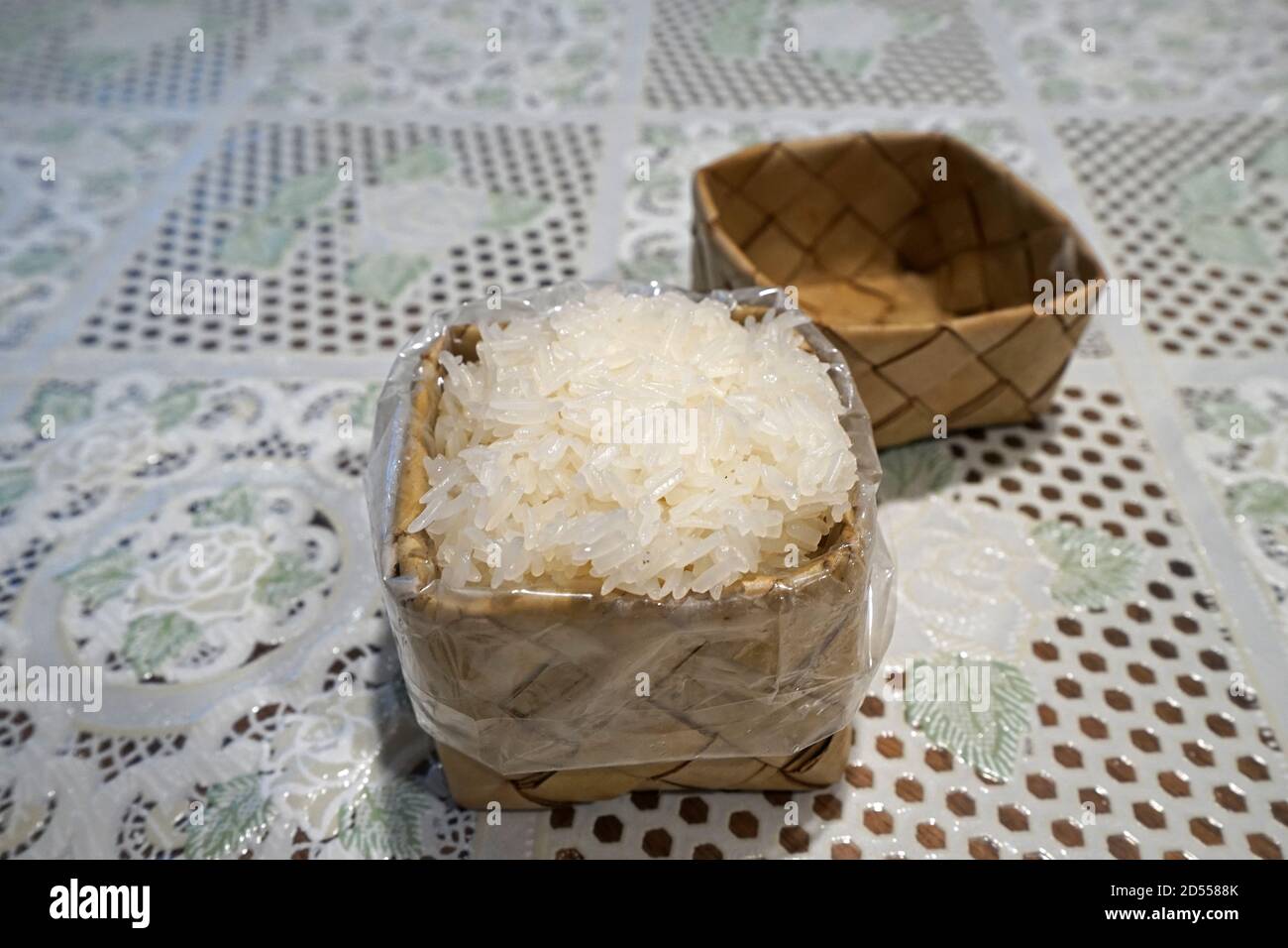 Close up Sticky rice served in traditional Thai Bamboo basket box ...