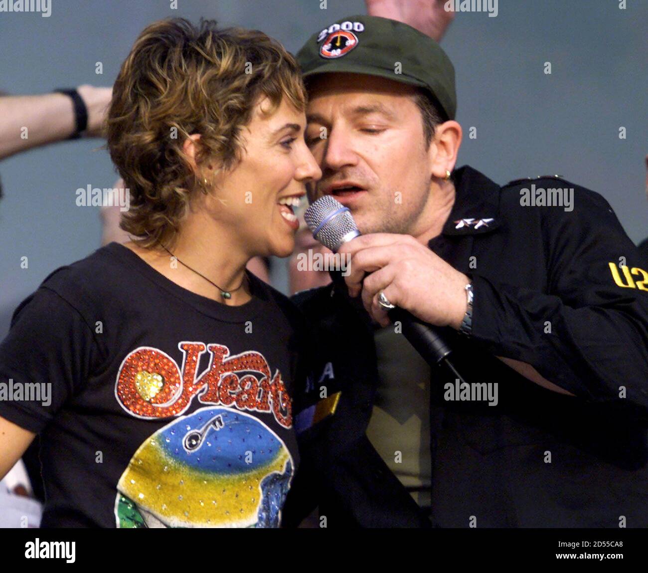 Singers Sheryl Crow and Bono sing at the NetAid concert in Giants ...