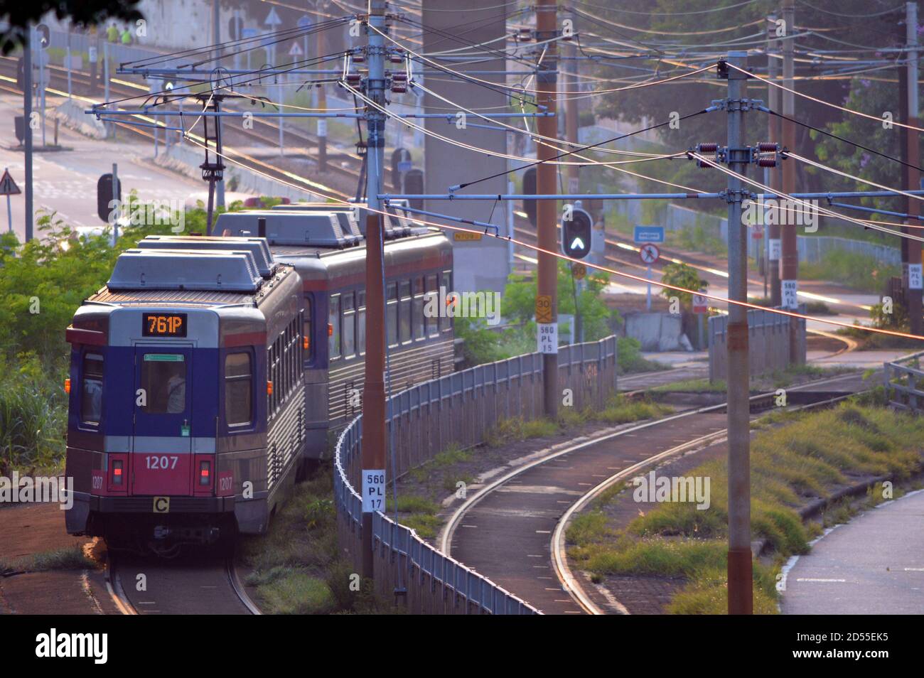 Hong Kong two-car light rail train departing Yuen Long for Tin Shui Wai ...