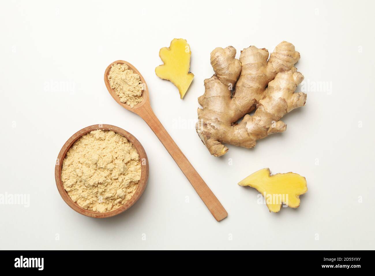 Ginger and bowl with ginger powder on white background Stock Photo - Alamy