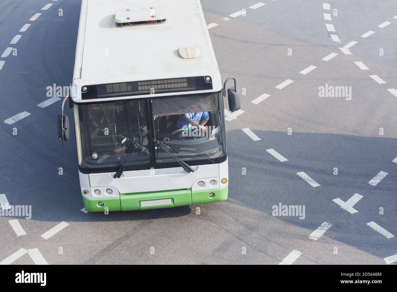 white city bus goes along street Stock Photo - Alamy