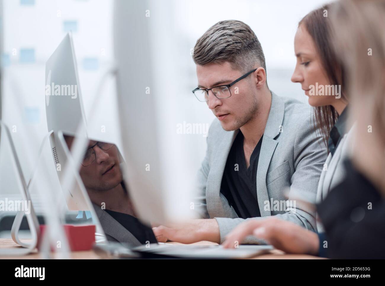 group of employees work with incoming information Stock Photo - Alamy