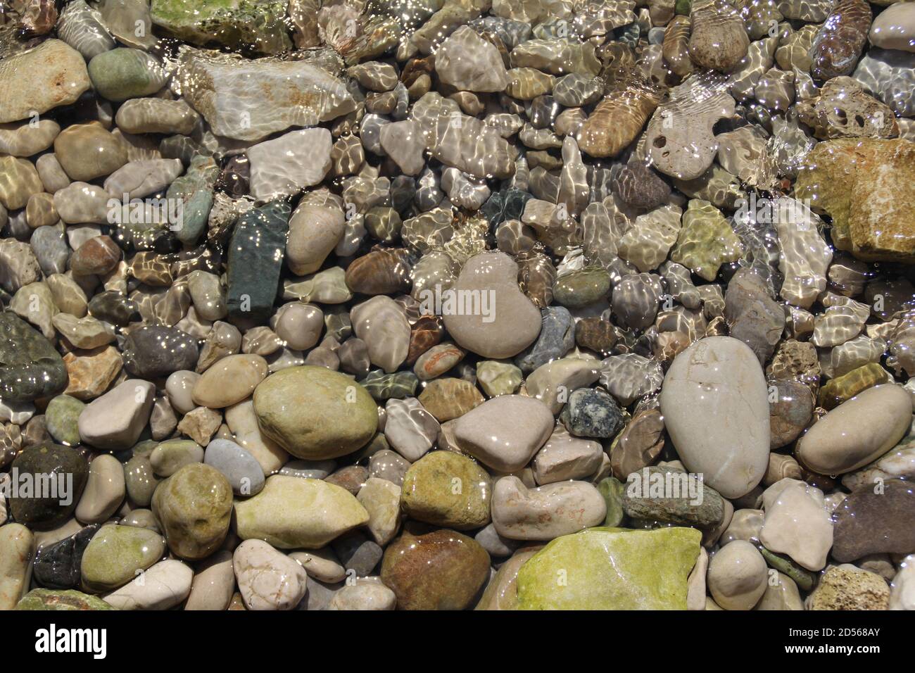 Abstract background with dry round stones Stock Photo - Alamy