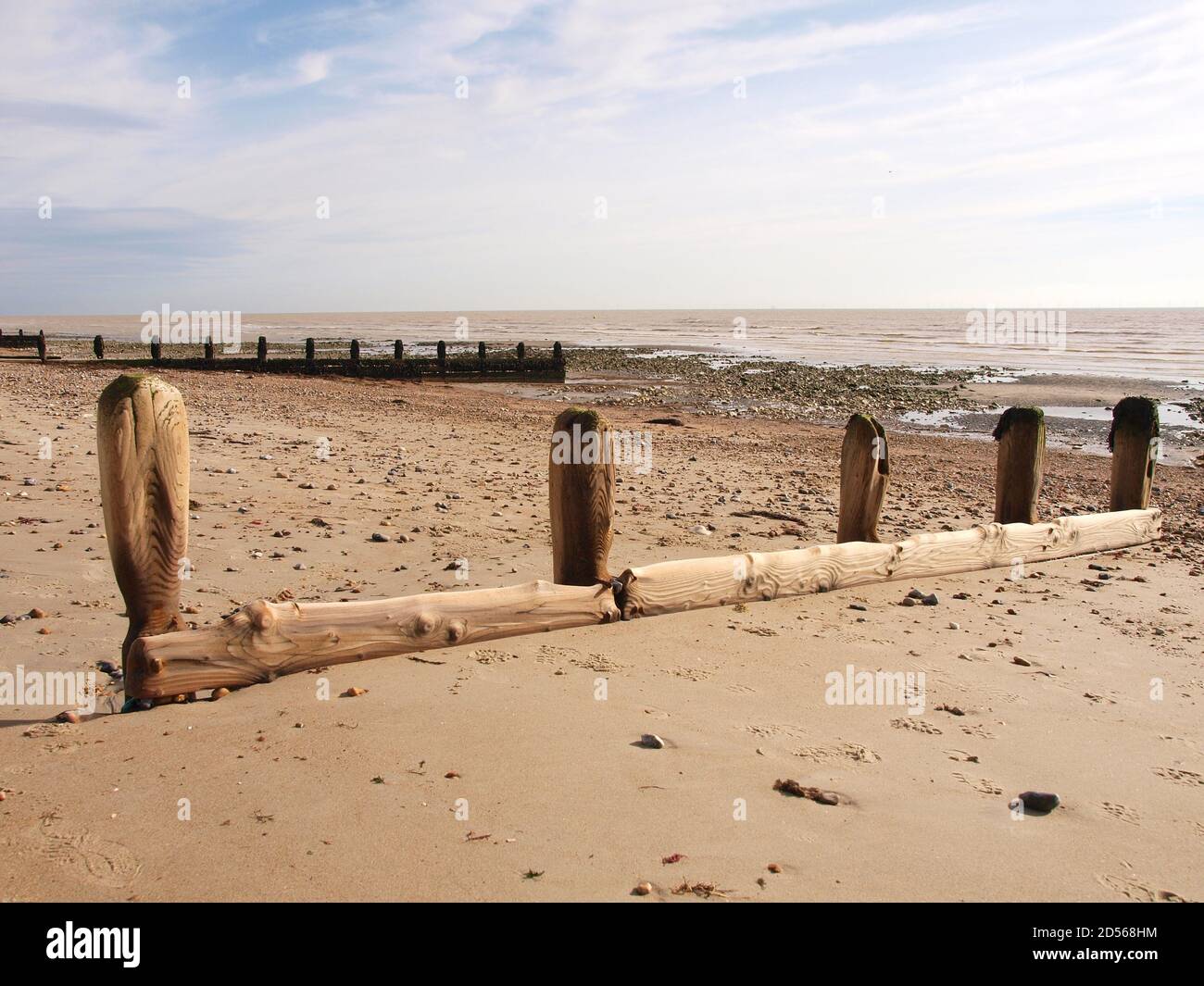 worn wooden groins on a beach Stock Photo - Alamy