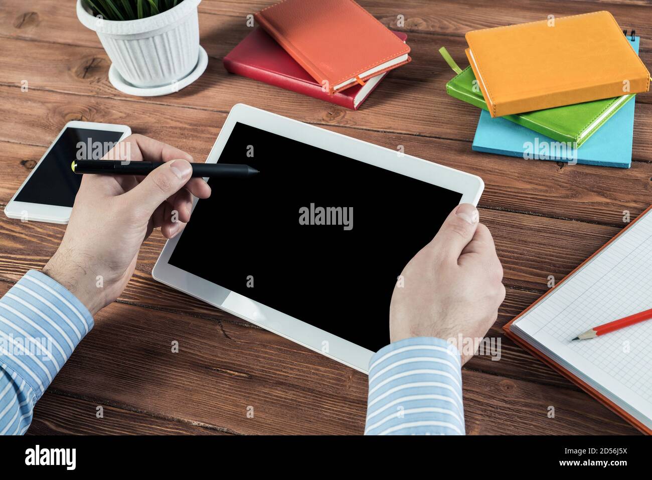 businessman with a tablet, works in the office Stock Photo - Alamy