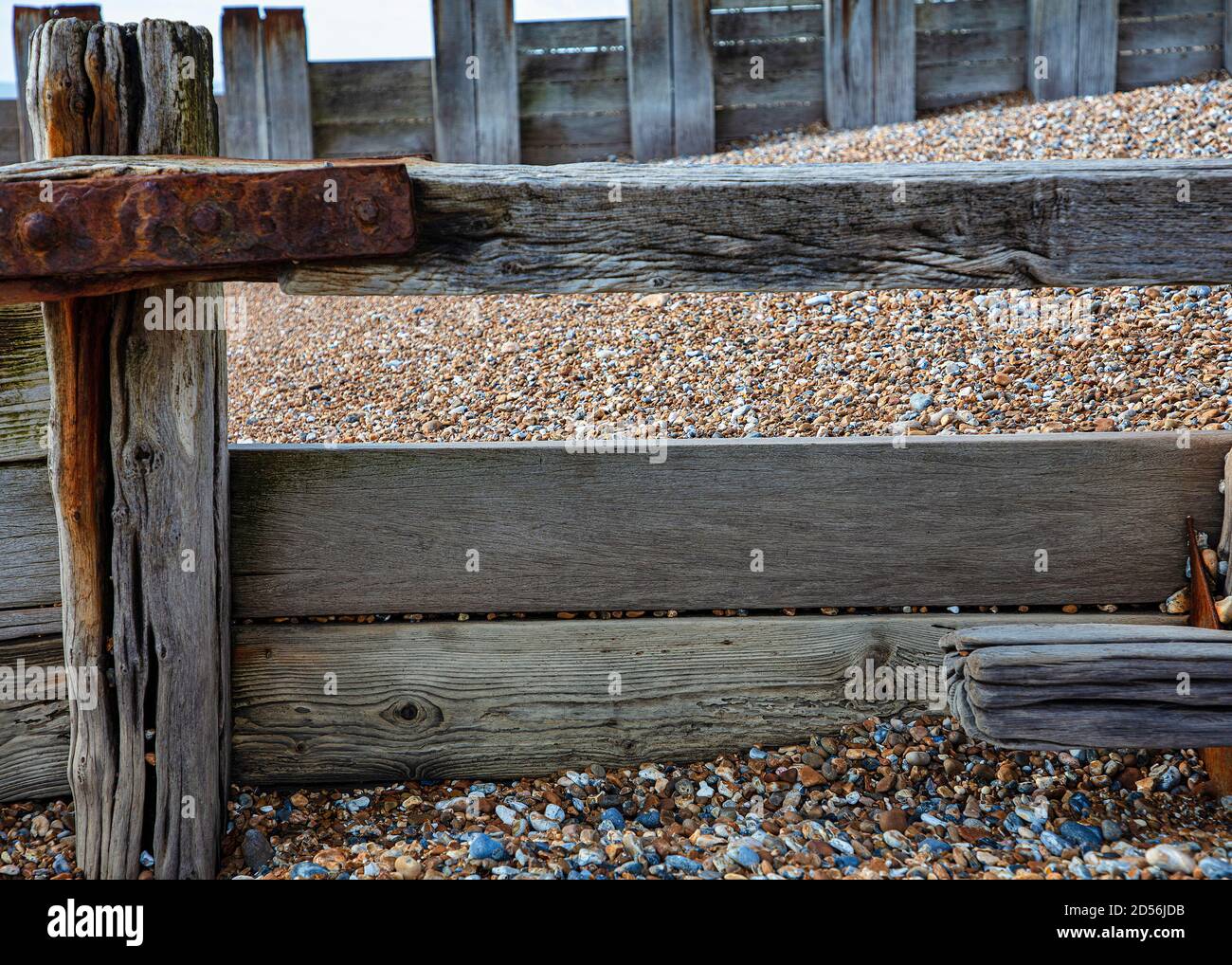 Weathered wooden sea defences on the beach at Bexhill, East Sussex ...