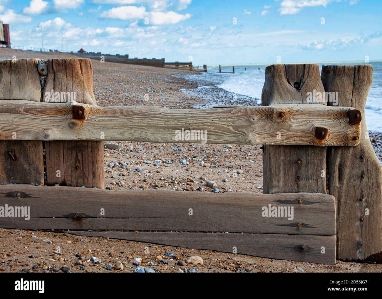 Weathered wooden sea defences on the beach at Bexhill, East Sussex ...