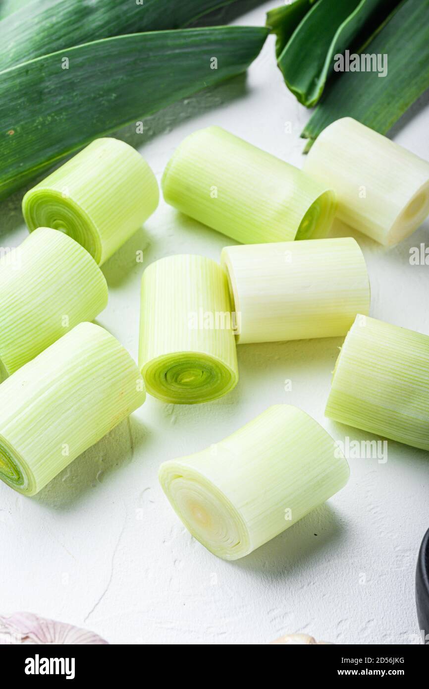 Chopped Leeks for grill uncooked with herbs ingredients , on textured ...