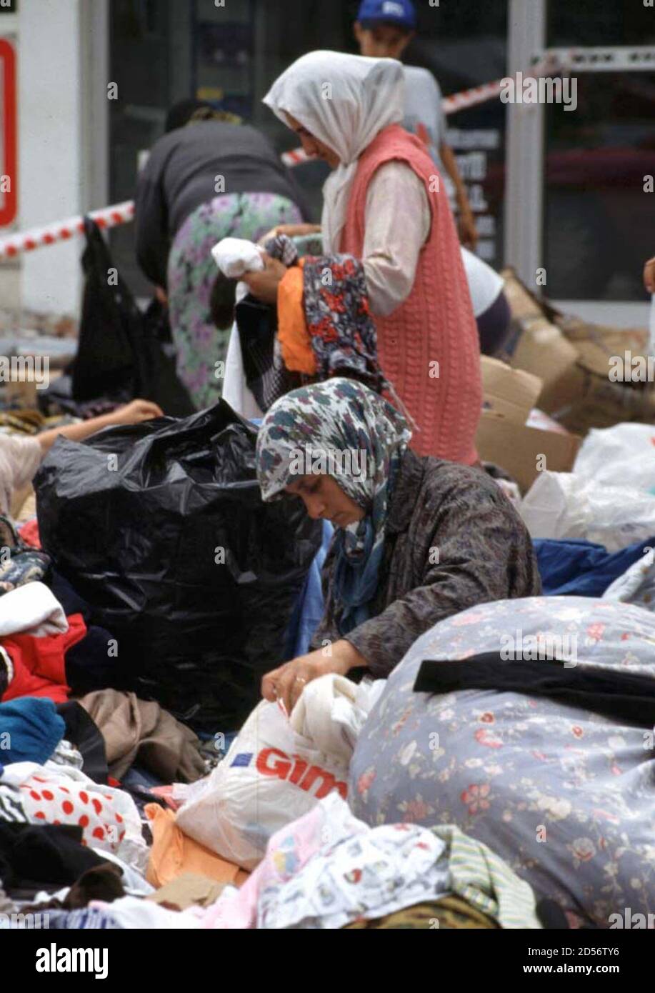 Buried under clothes hi-res stock photography and images - Alamy