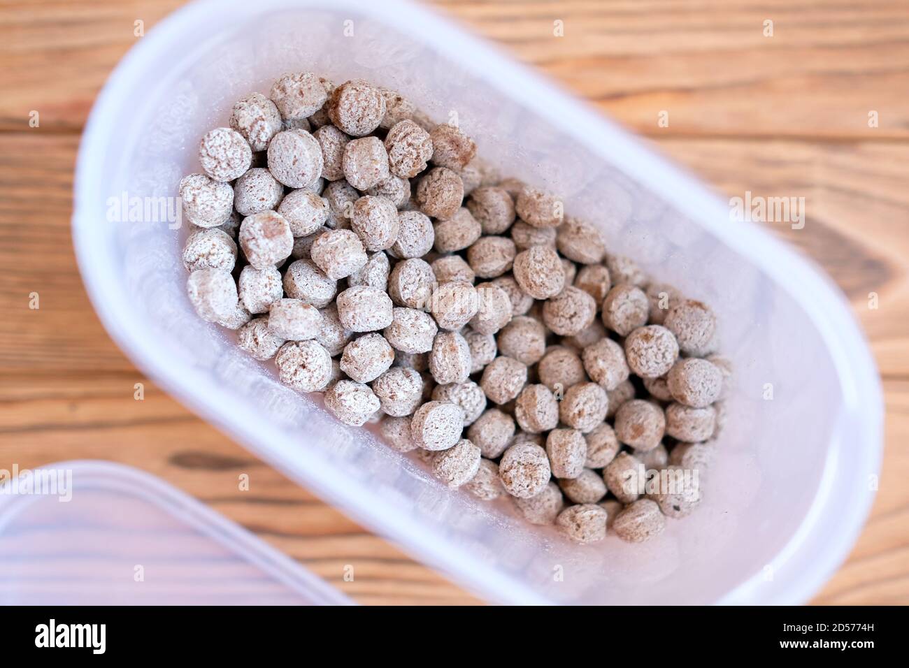 Bran in a container. Dry edible balls Stock Photo - Alamy