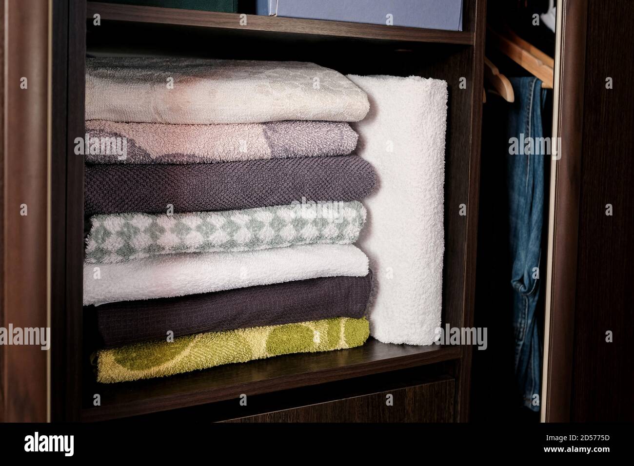 Terry towels are on the shelf in the closet Stock Photo - Alamy