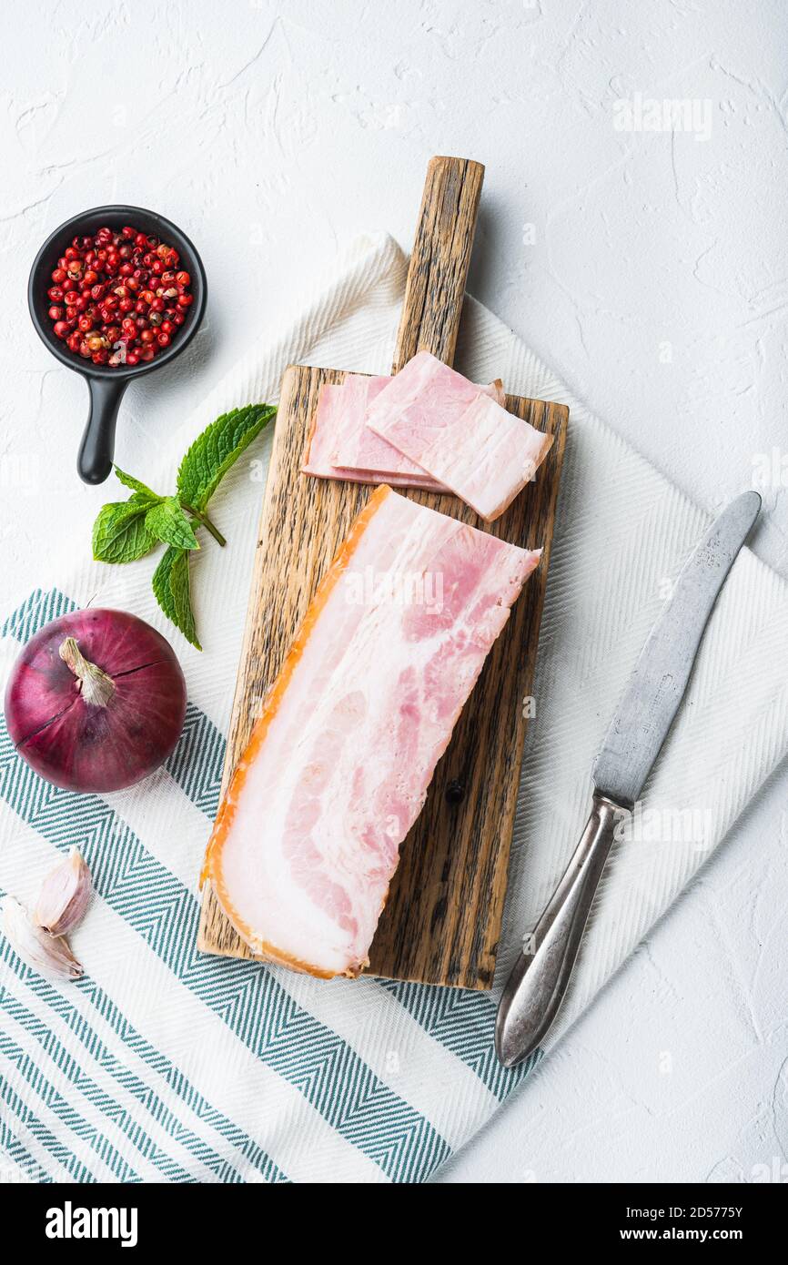 Smoked bacon, whole slab with herbs on white background, top view Stock ...