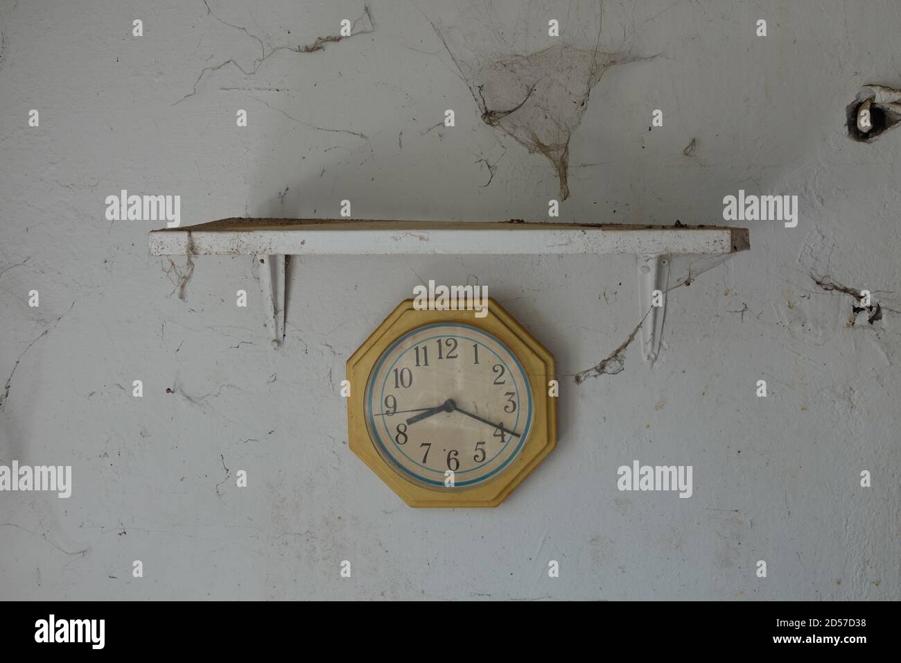 Old dusty clock and wall with cobweb in abandoned house Stock Photo - Alamy