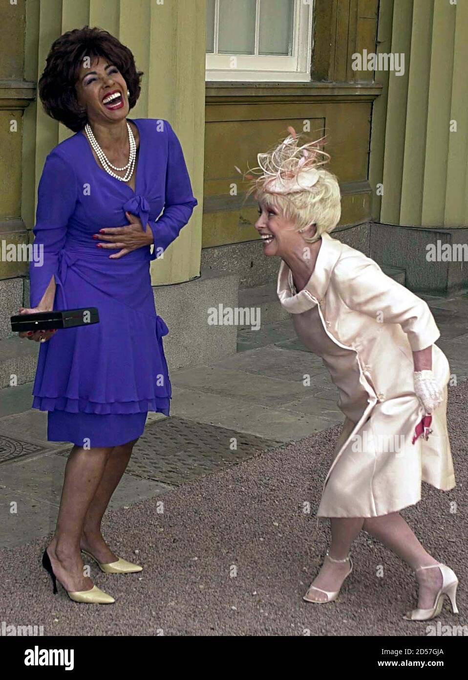 Receives An Mbe From The Queen At Buckingham Palace High Resolution ...