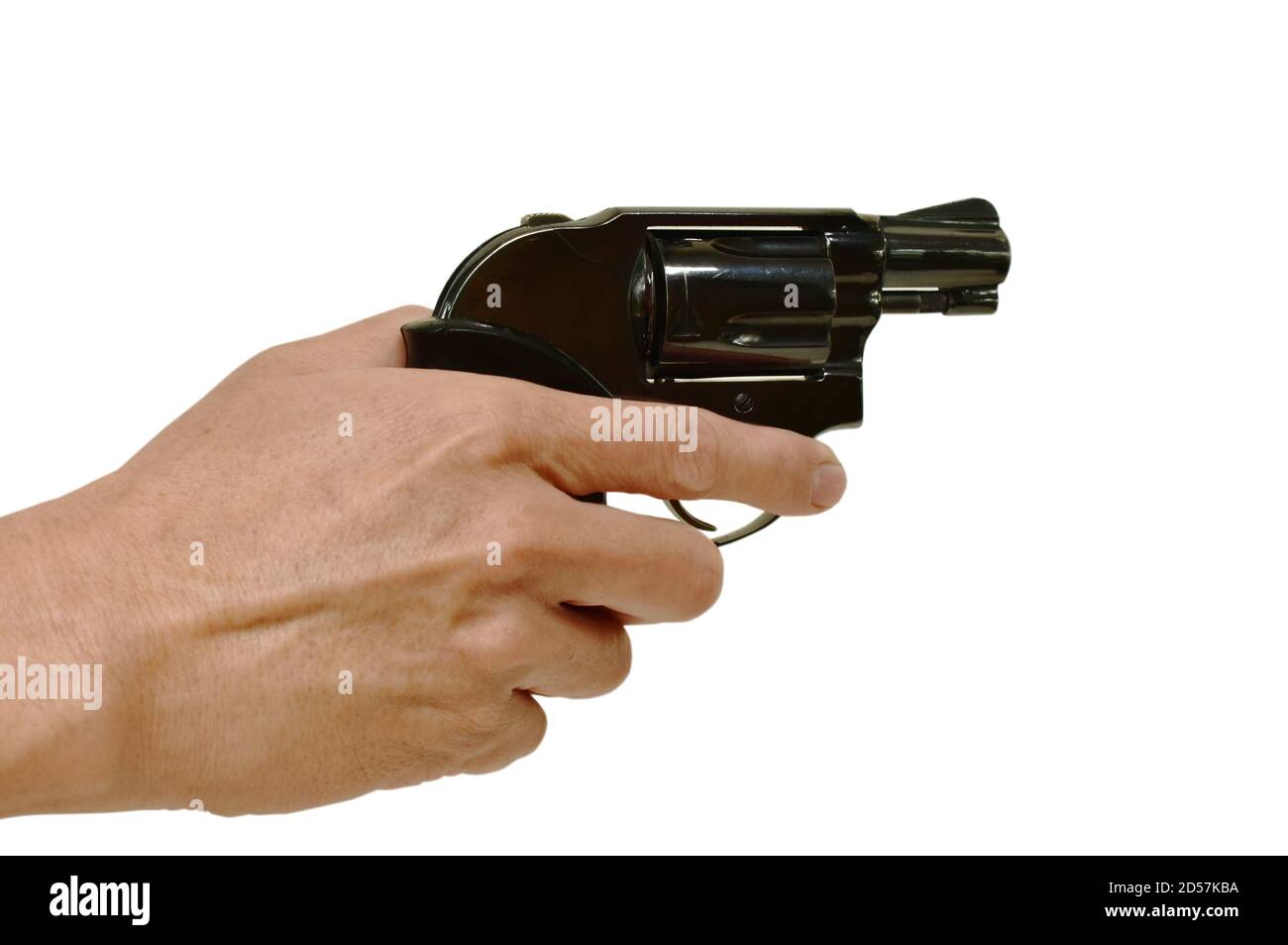 hand holding revolver gun and finger out from trigger for safety in ...