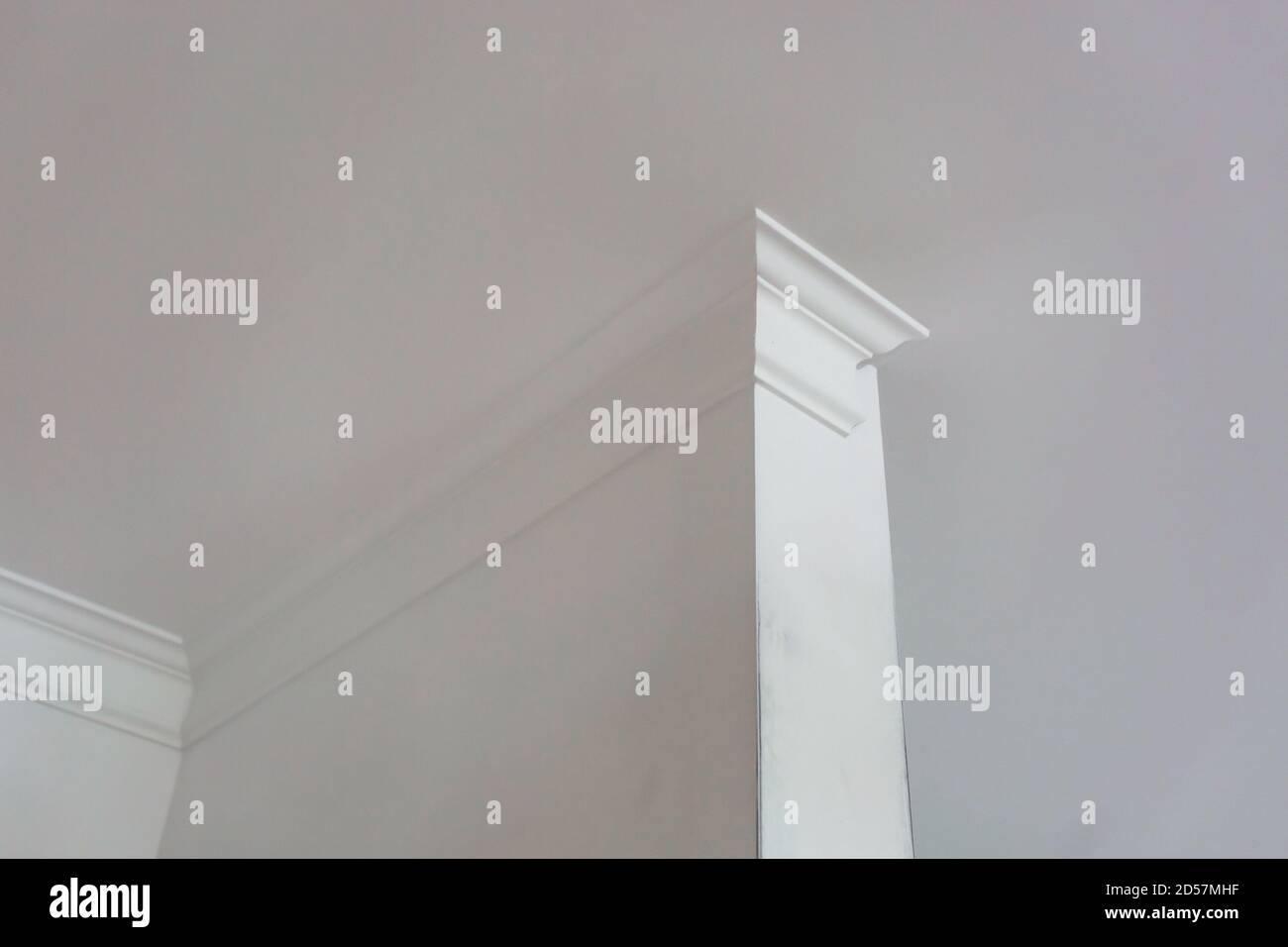 Detail of corner ceiling with intricate crown molding Stock Photo - Alamy