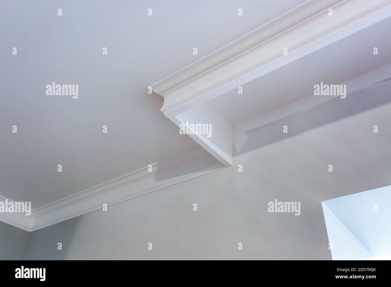 Detail of corner ceiling with intricate crown molding Stock Photo - Alamy