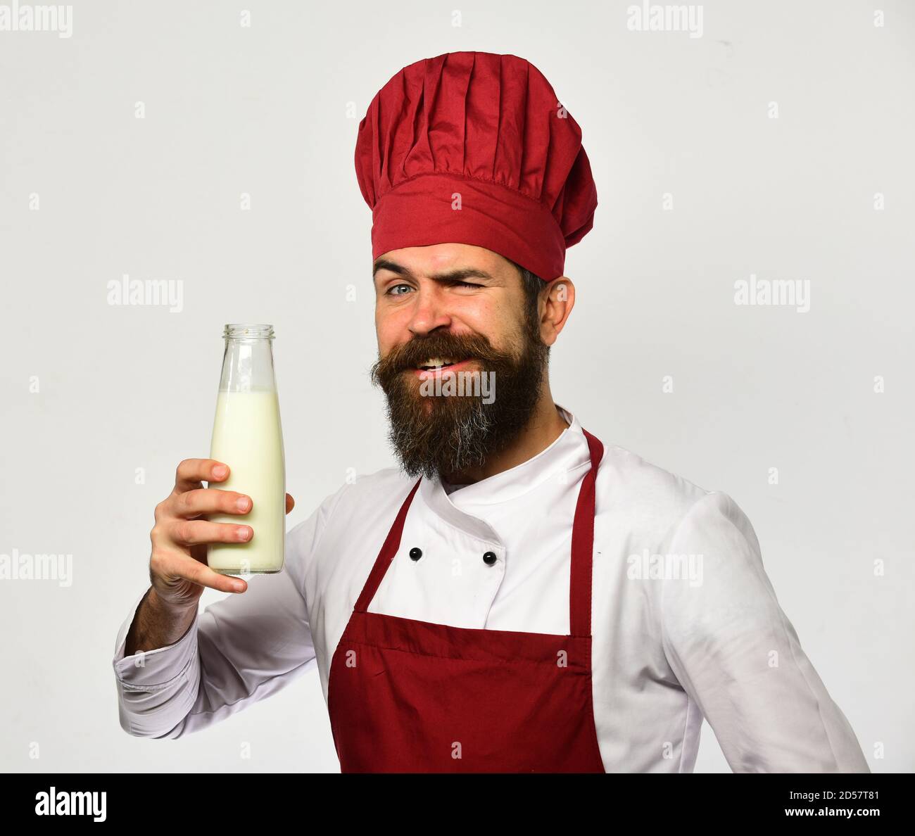 Chef with milkshake or yoghurt. Homemade food concept. Cook with flirty ...