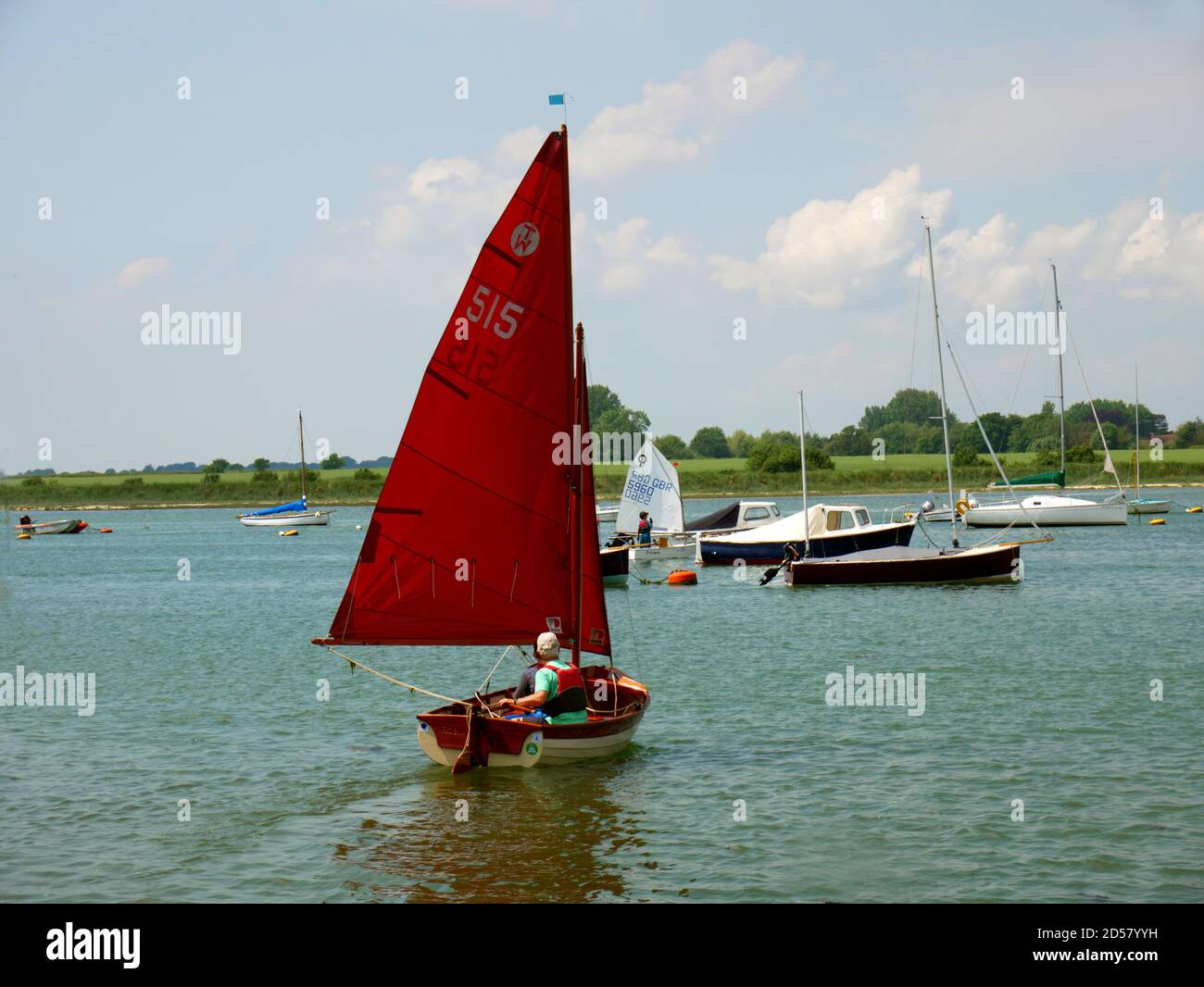 Sailing a Tideway dinghy at Bosham, Chichester, West Sussex Stock Photo ...