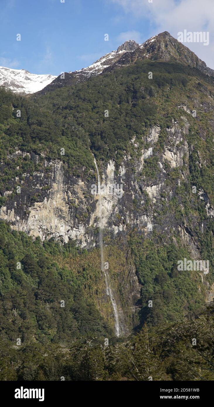 Hiking the Kepler Track during spring in the snow within Fiordland ...