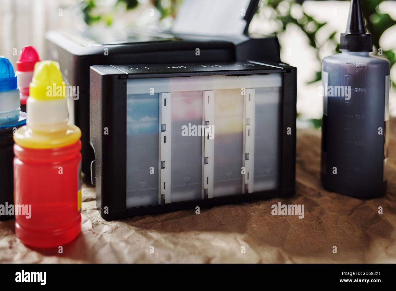 Refilling printer cartridges with multi-colored ink. Background Stock ...