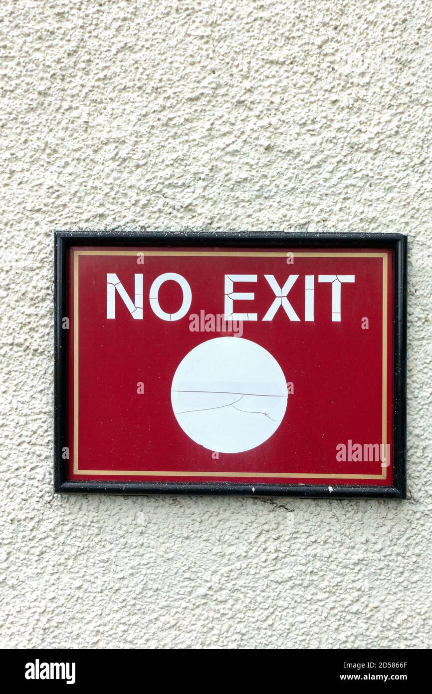 White words No Exit sign on red background on wall Stock Photo - Alamy