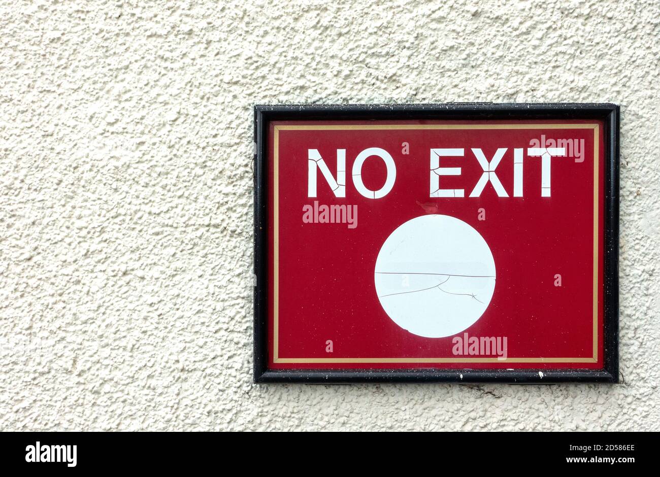 White words No Exit sign on red background on wall Stock Photo - Alamy