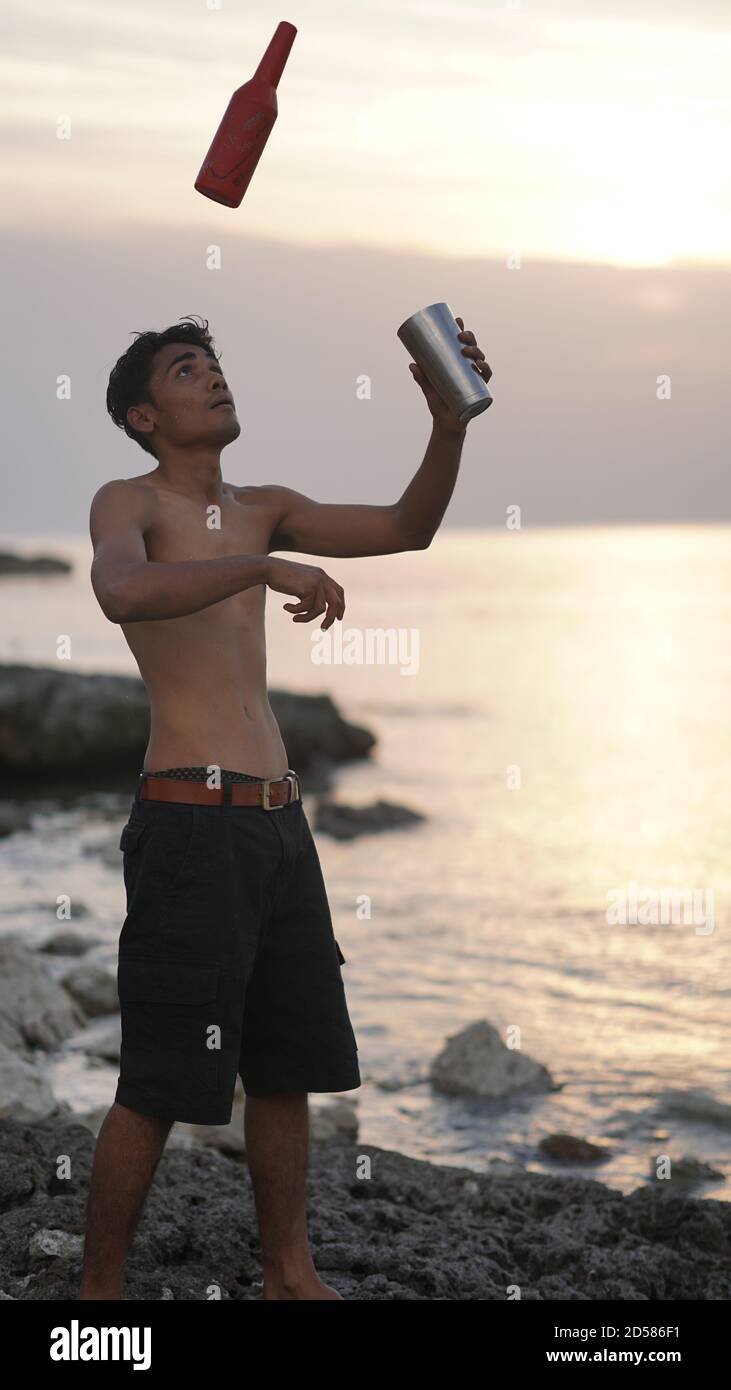 bartender practicing at beach Stock Photo - Alamy