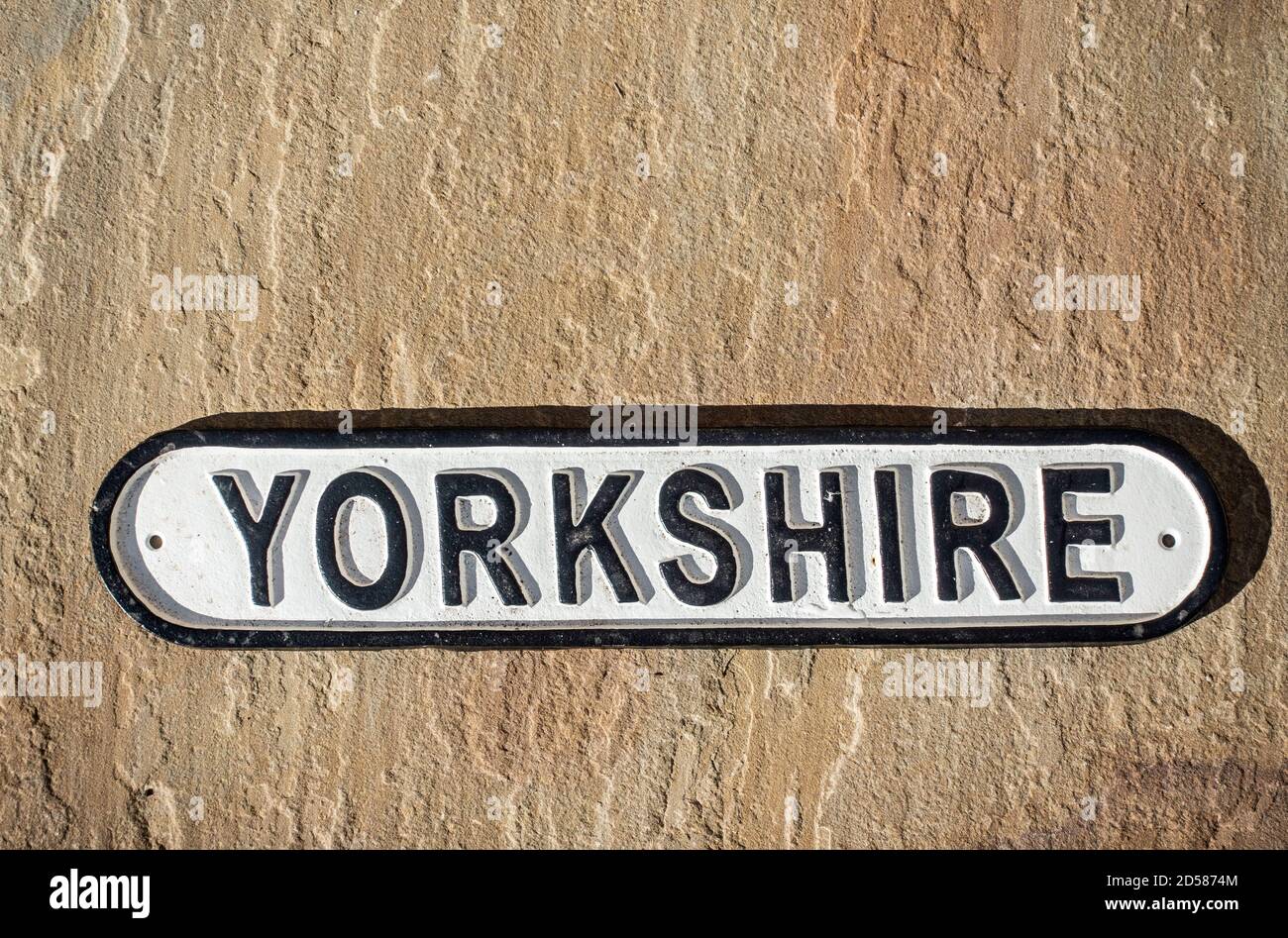 Yorkshire metal street name sign on Yorkshire stone Stock Photo - Alamy